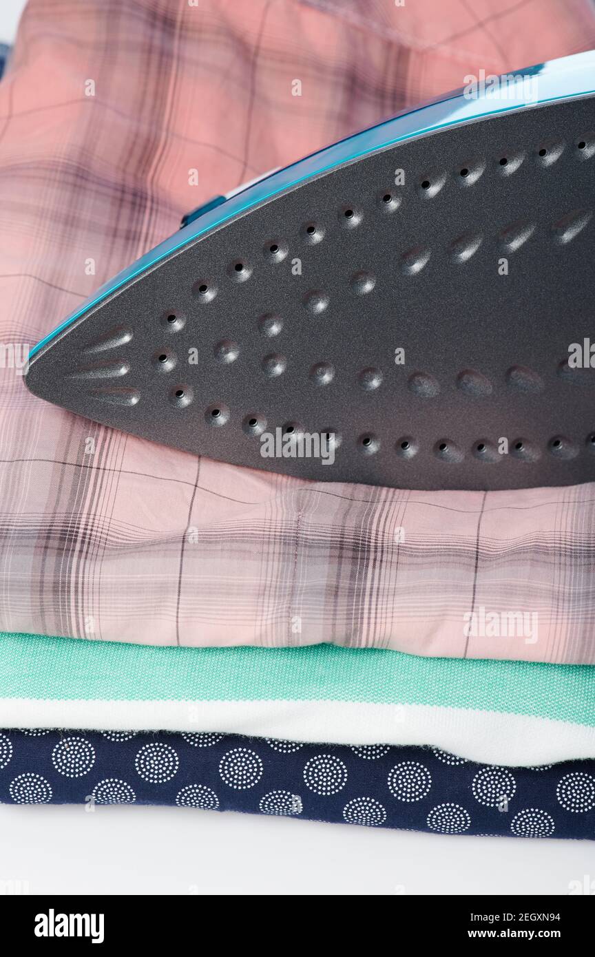Ironing clothes service theme. Laundry work background Stock Photo - Alamy