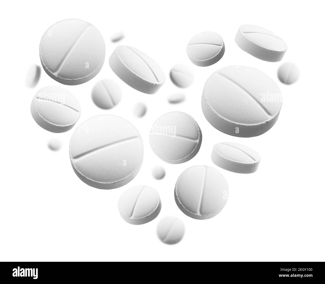 White round tablets in the shape of a heart on a white background Stock ...