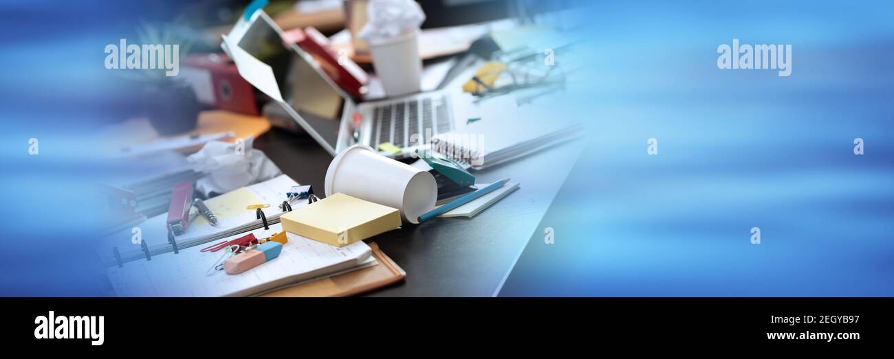 Messy and cluttered office desk; panoramic banner Stock Photo - Alamy