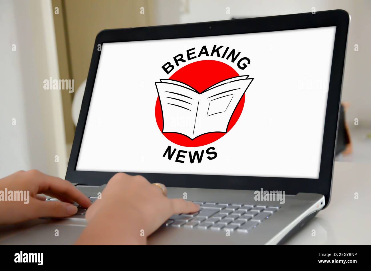 Hands on a laptop with screen showing breaking news concept Stock Photo ...