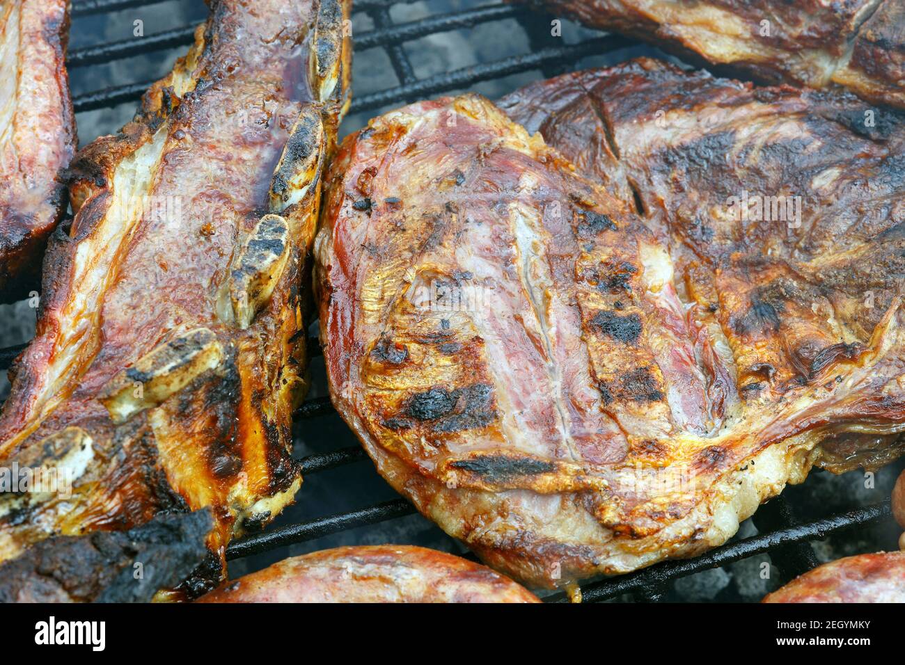 Meat cooking at parrilla restaurant hi-res stock photography and images ...