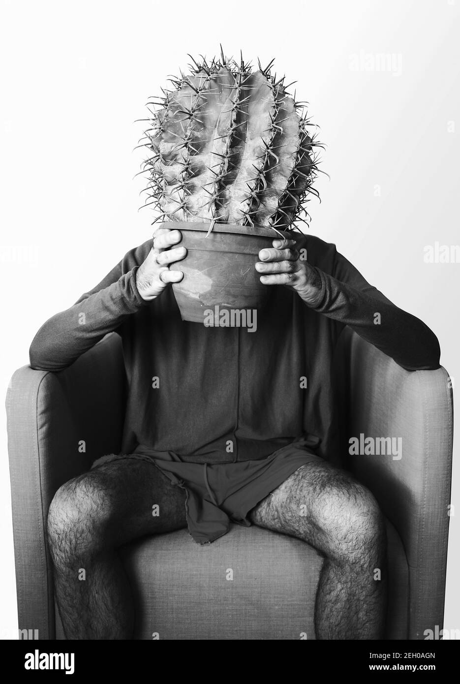 Hiding behind chair Black and White Stock Photos & Images - Alamy