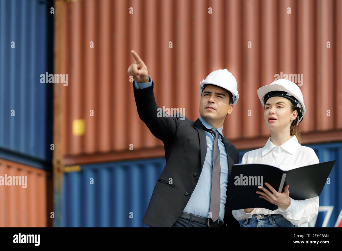 A caucasian man manager explaining logistics transportation system in ...