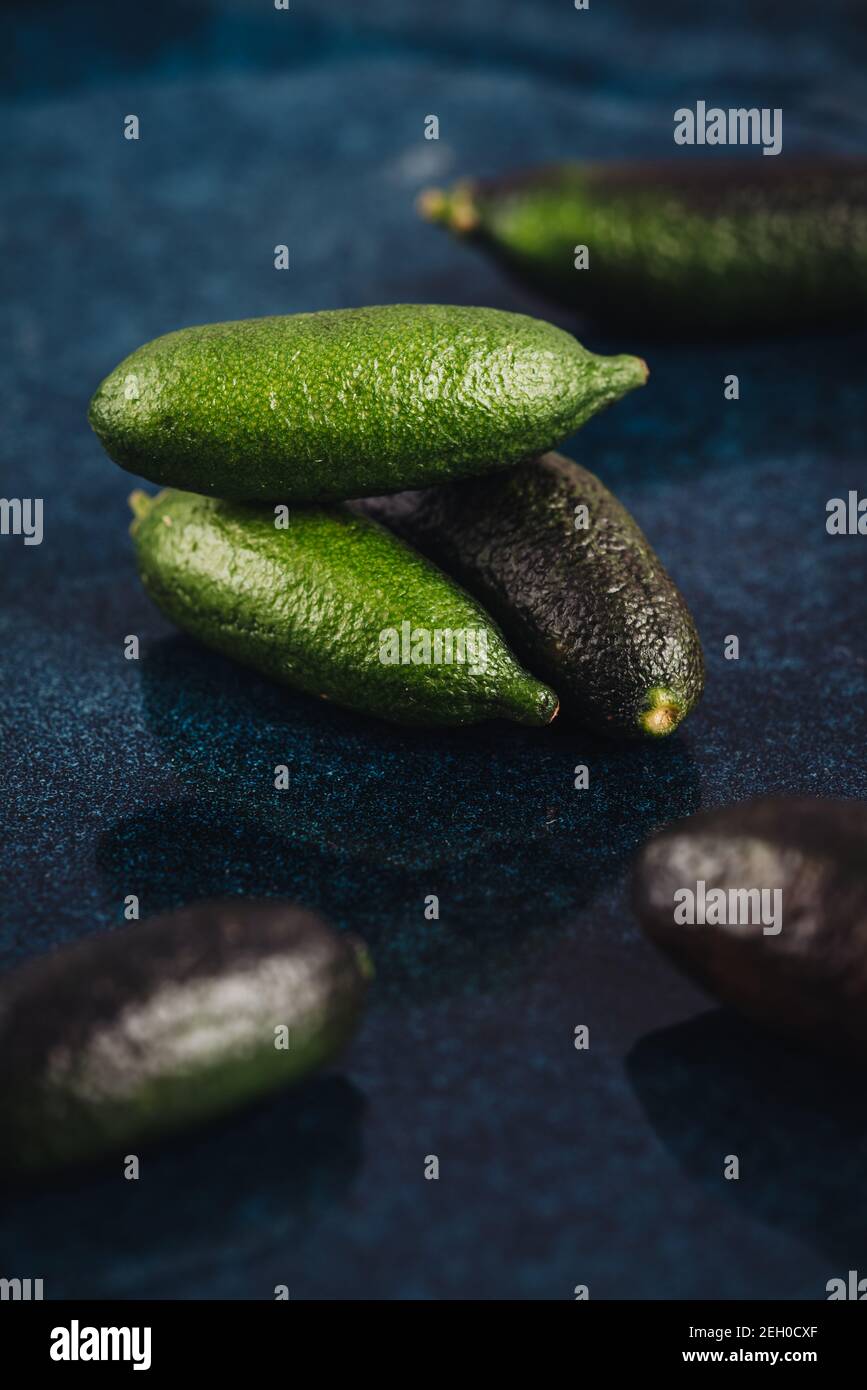 Bunch of fresh tasty finger limes fruits on a table Stock Photo - Alamy