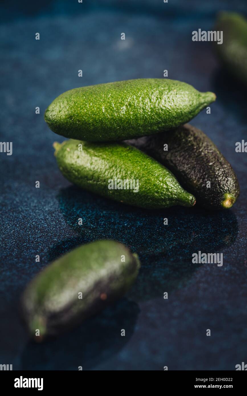 Bunch of fresh tasty finger limes fruits on a table Stock Photo - Alamy