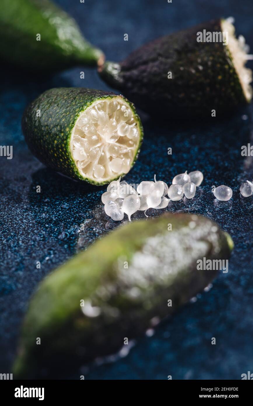 Bunch of fresh tasty finger limes fruits on a table Stock Photo - Alamy