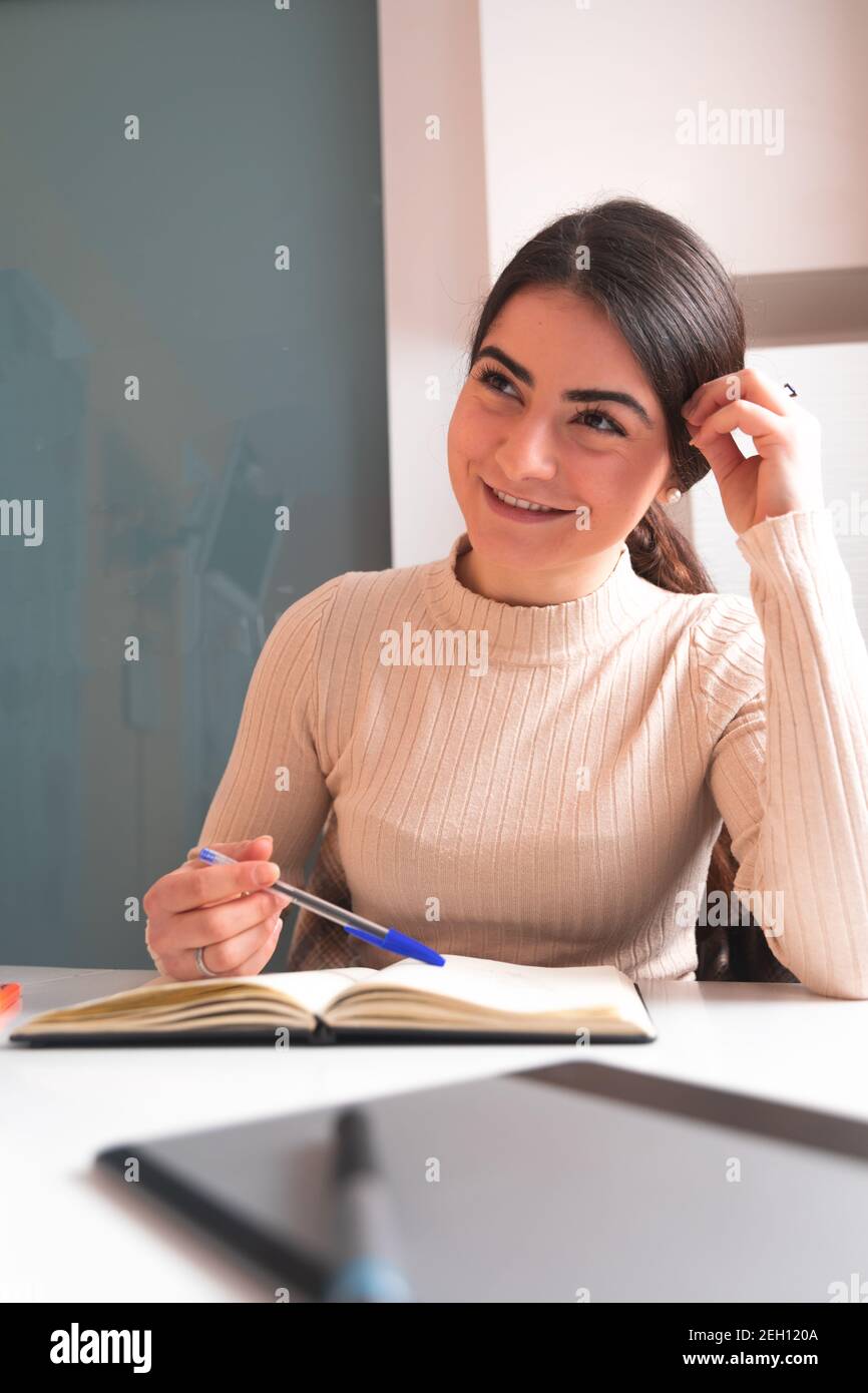 Young woman studying at home Stock Photo - Alamy