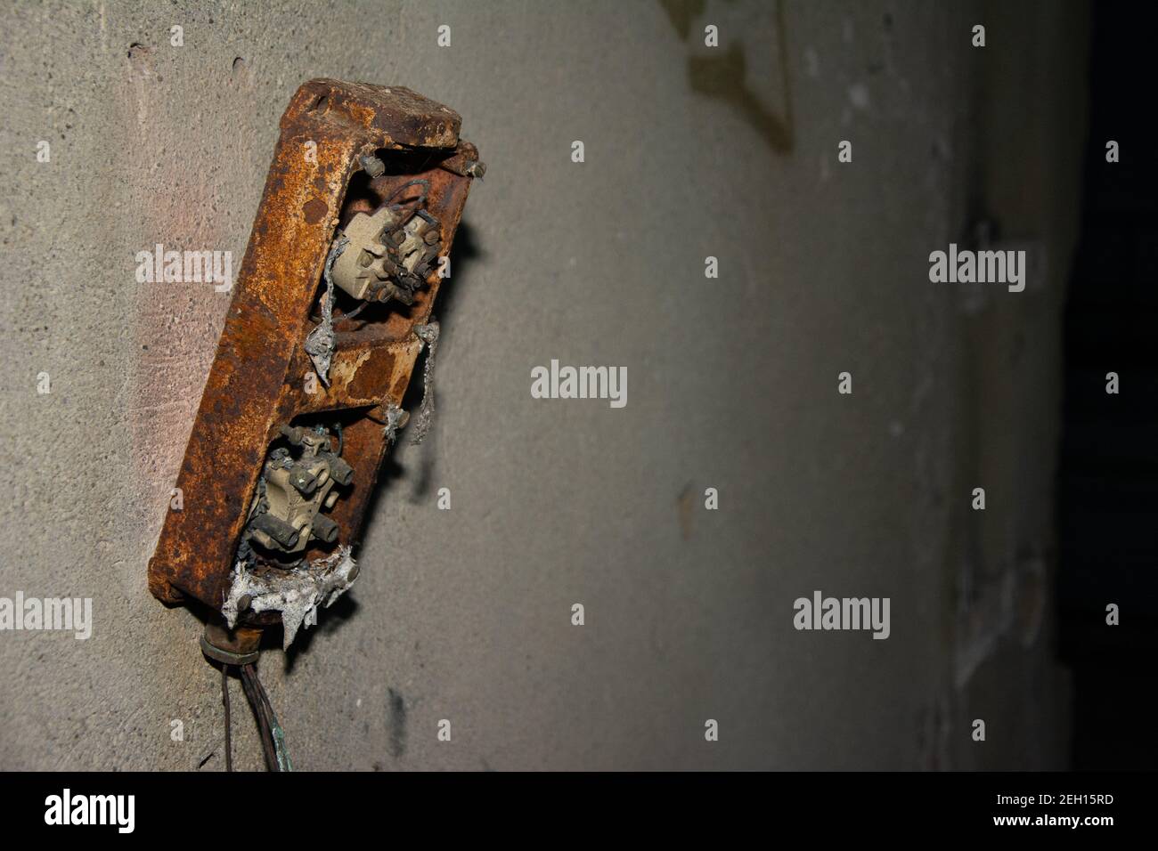 Old rusty plug on a grunge wall Stock Photo - Alamy