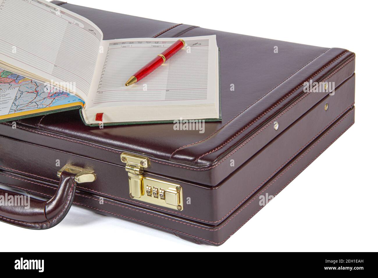 Modern leather suitcase with notebooks and pen, isolated on white ...