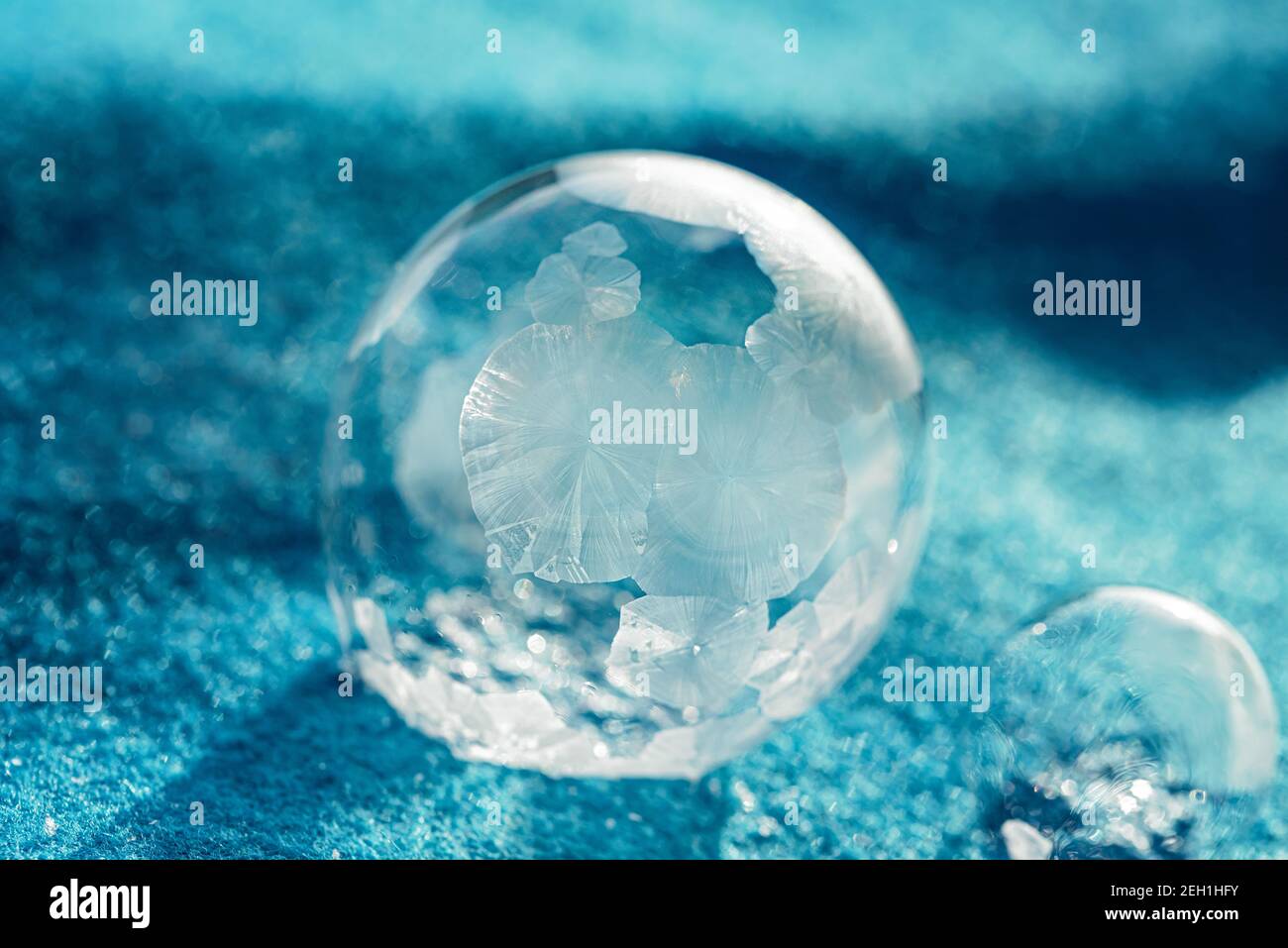frozen bubble with bokeh background. Beautiful frosty patterns on ...