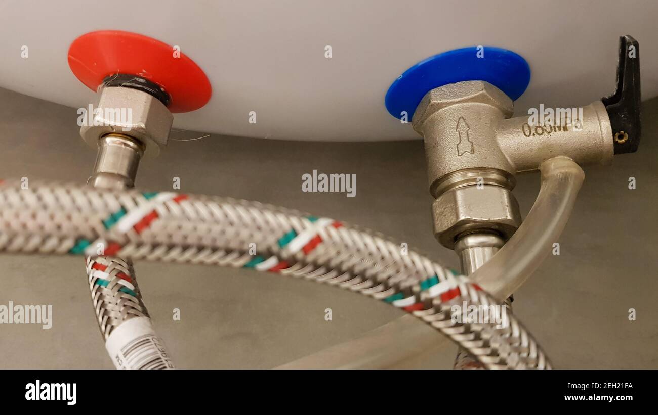 Connection of water supply, hot and cold water to the boiler. Hose for ...