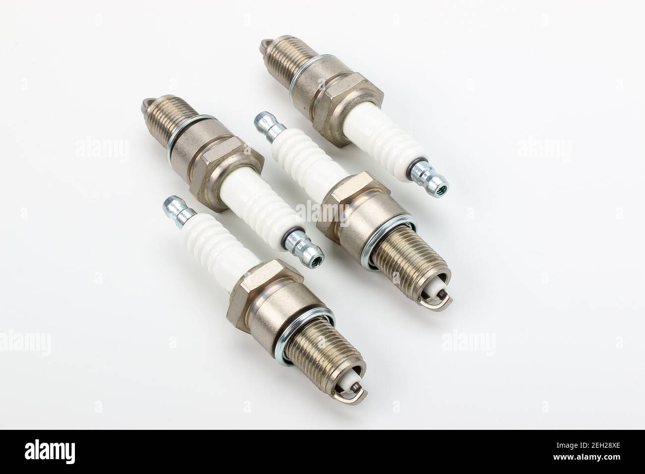 Spark plug set with a white background upside down Stock Photo - Alamy