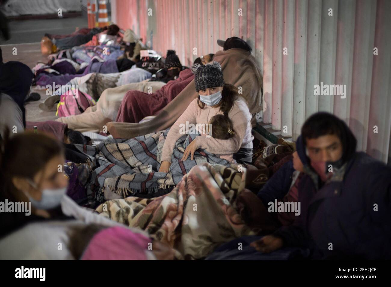 19 February 2021, Mexico, Tijuana: Dozens of migrants of Central ...