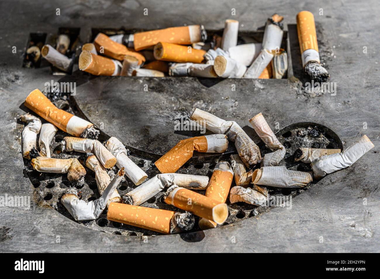 Cigarette ends in public sculpture Stock Photo - Alamy