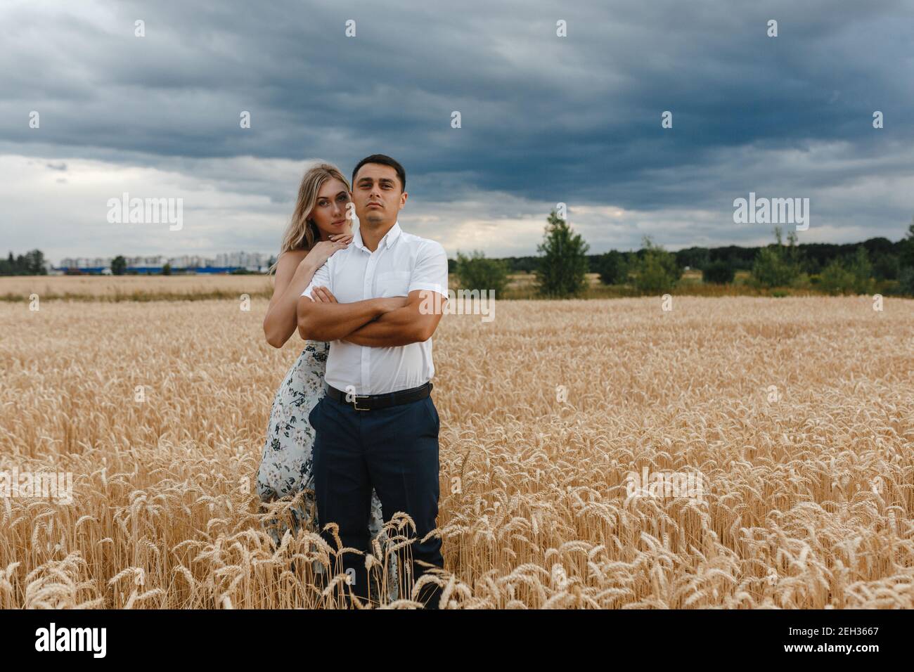 Love story of a young beautiful couple in beautiful wheat field Stock ...