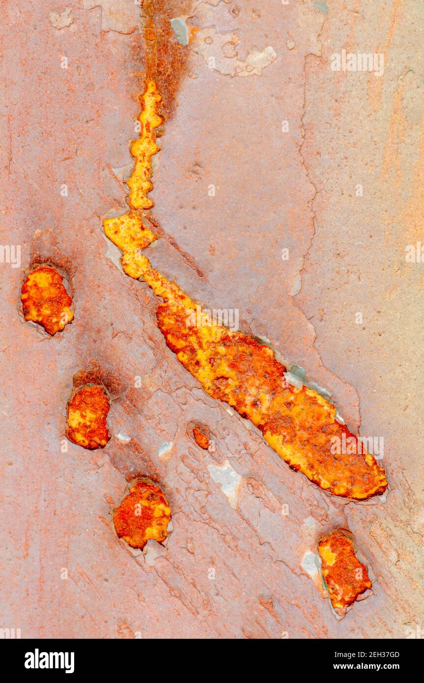 Rust patches on pastel colour metal surface Stock Photo - Alamy