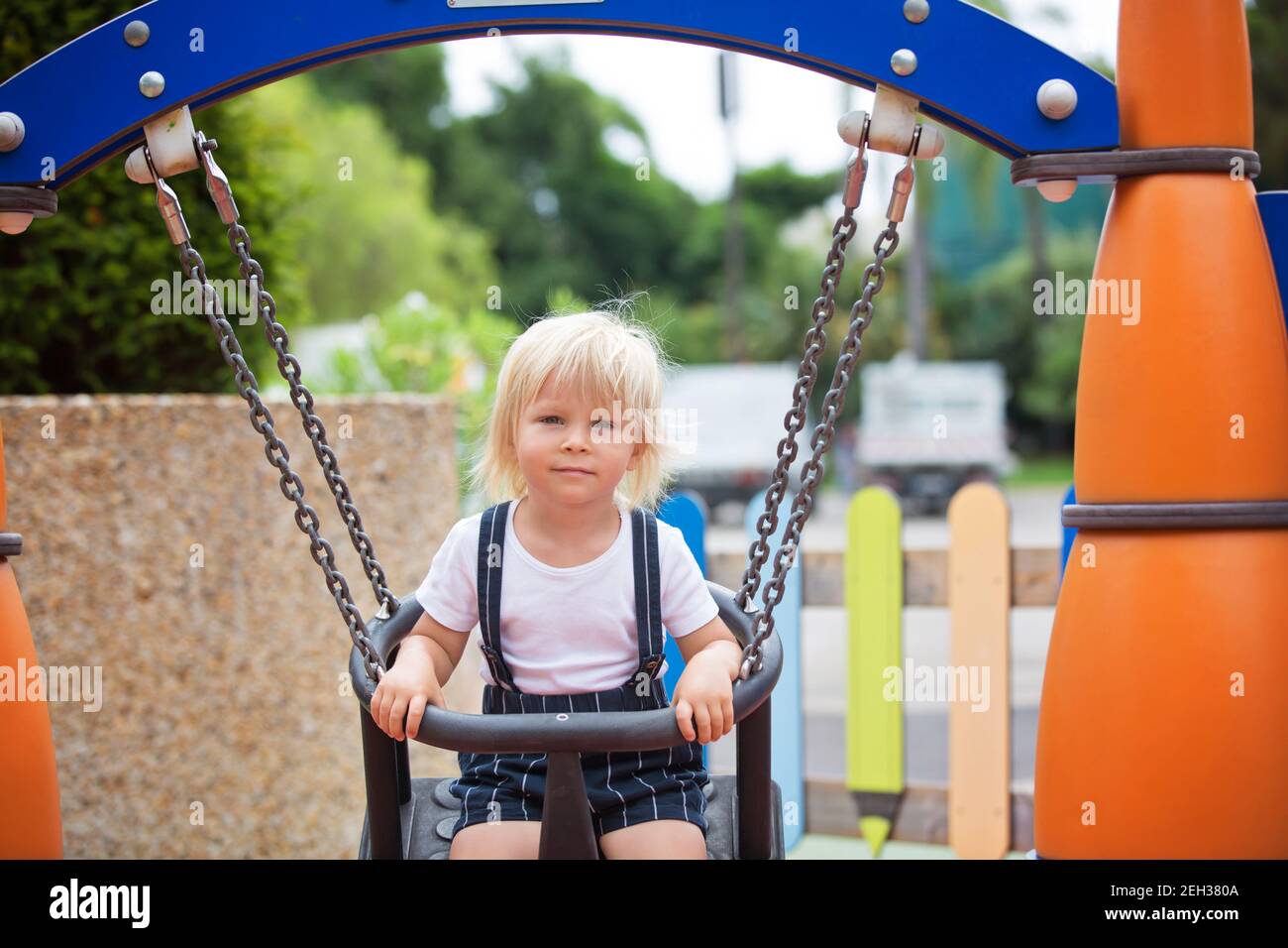 Sweet toddler child, boy, playing on the playground summertime Stock ...