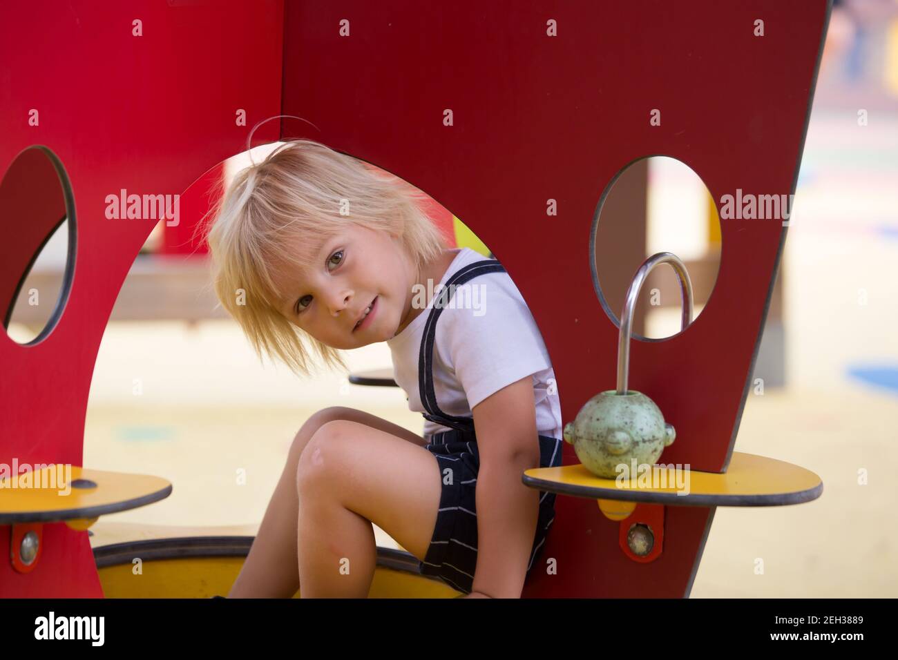 Sweet toddler child, boy, playing on the playground summertime Stock ...