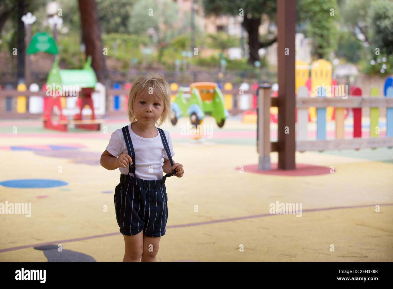 Sweet toddler child, boy, playing on the playground summertime Stock ...