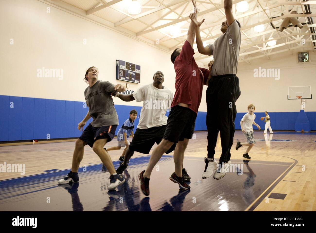 President Barack Obama plays basketball with senior staff and their ...