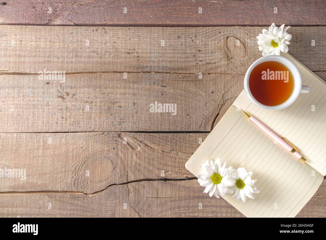 Cozy breakfast in spring or early autumn tea with bouquet of Chamomile ...