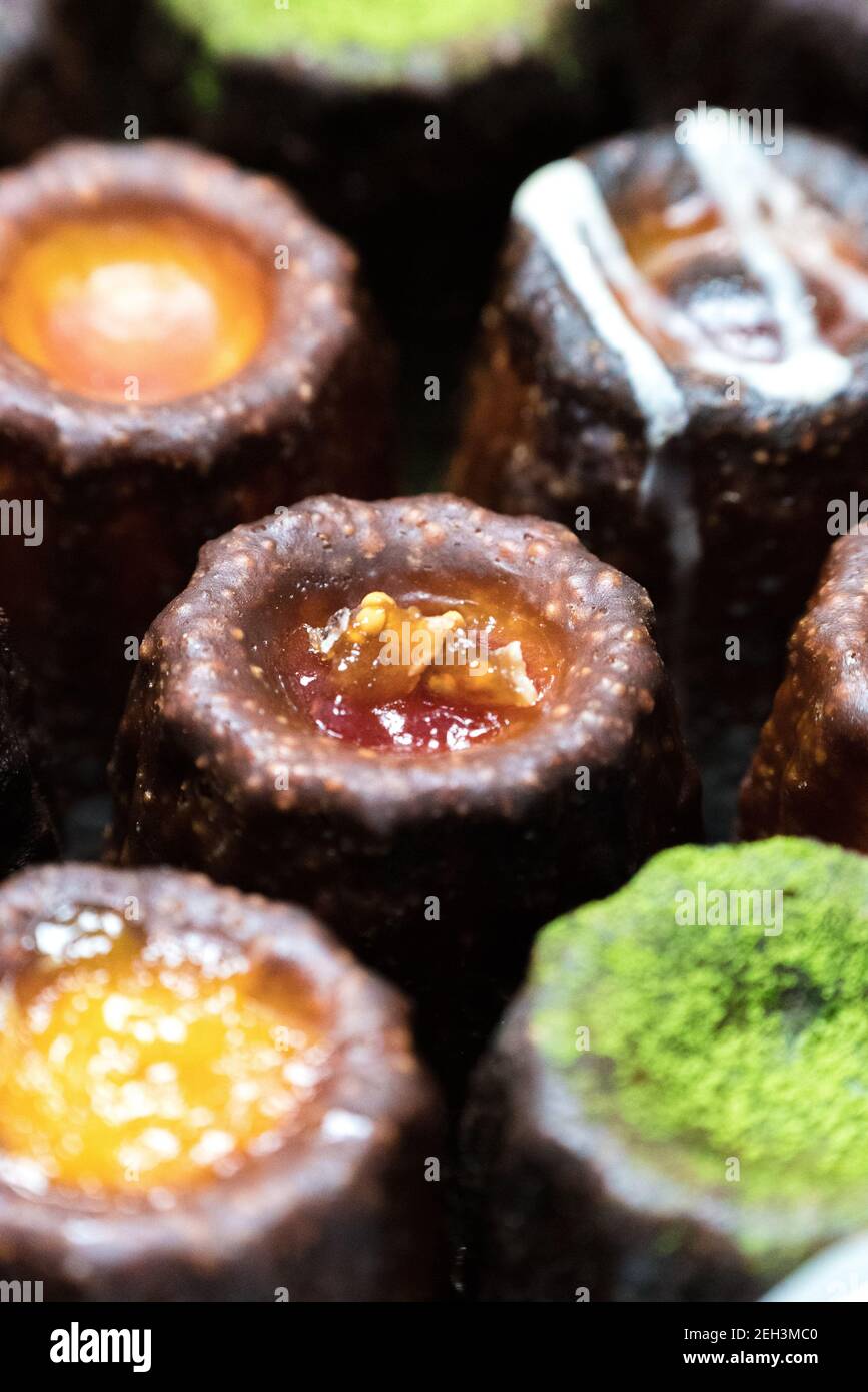 Caneles de bordeaux is a small pastry with rum and vanilla, traditional ...