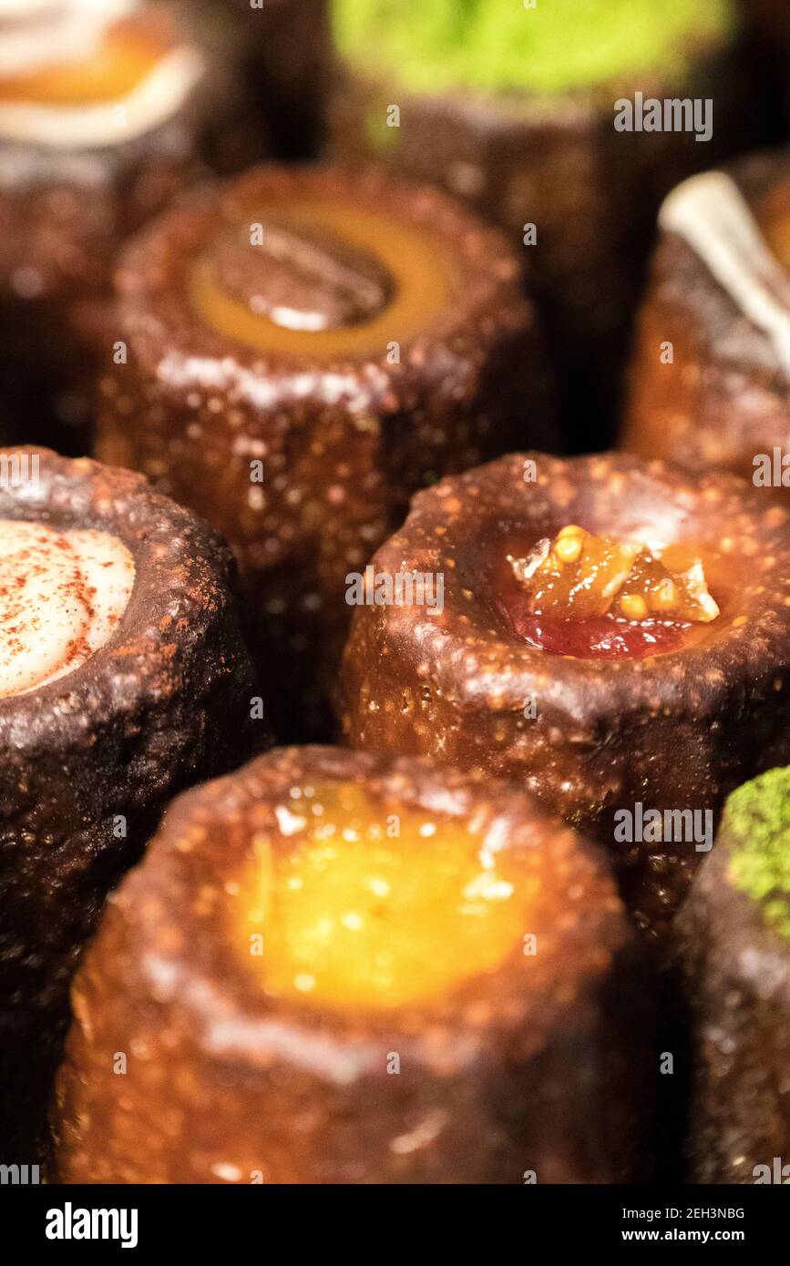 Caneles de bordeaux is a small pastry with rum and vanilla, traditional ...