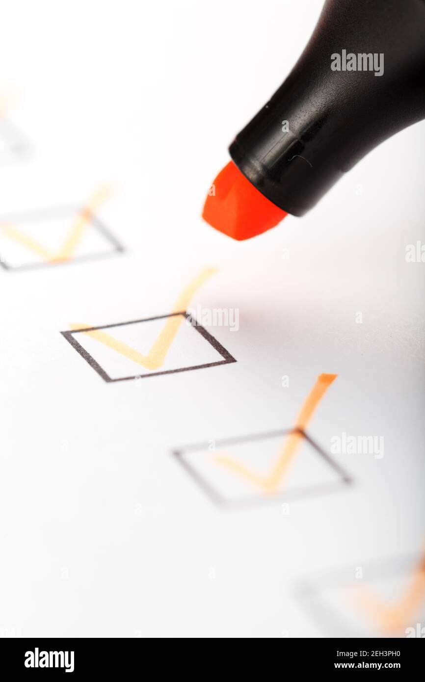 Orange marker with markers on the checklist sheet. Checklist completed ...