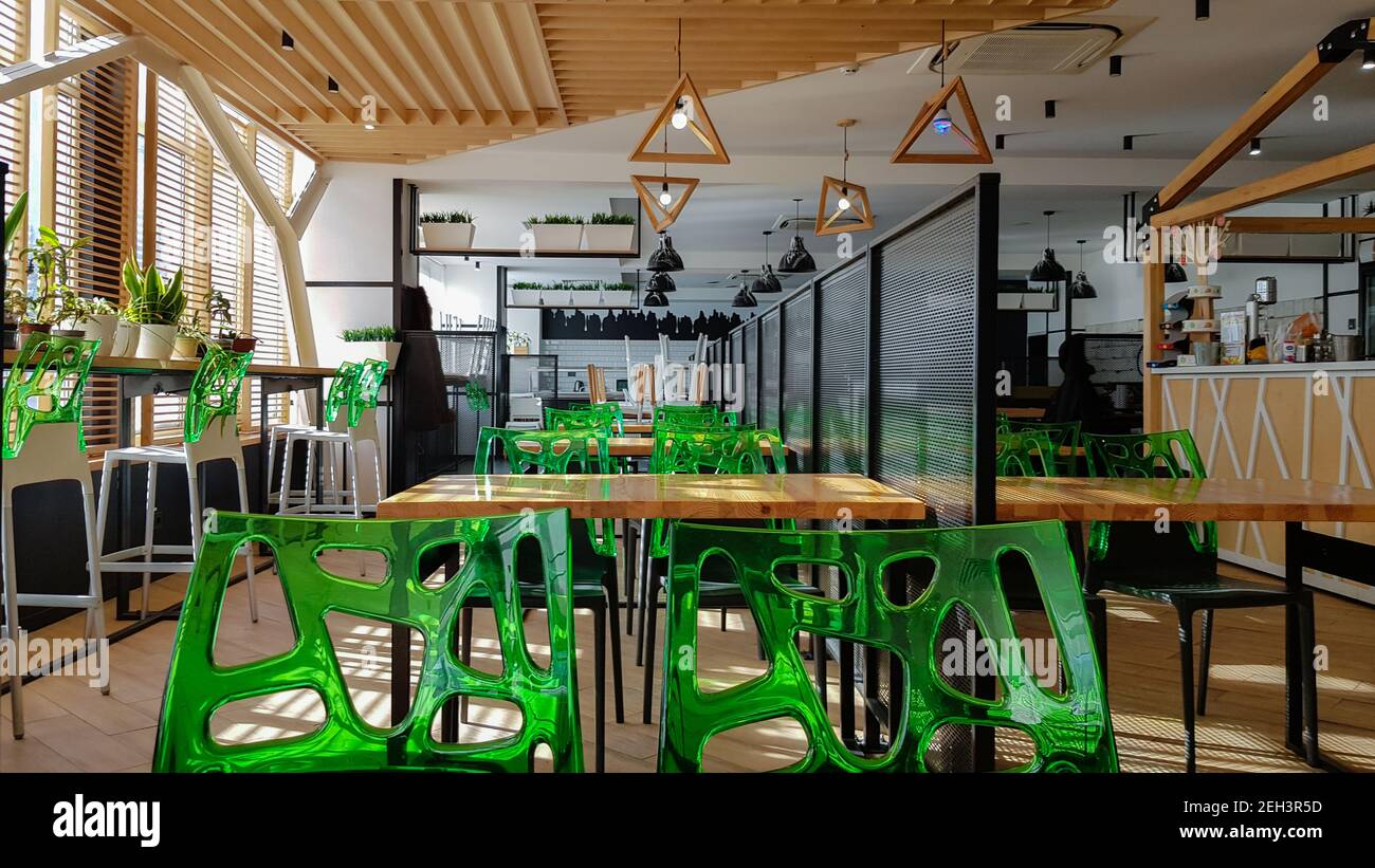 Large cafeteria, no people dining room with lots of wooden tables and ...