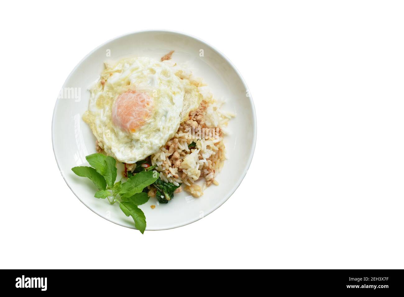 spicy fried chop pork with basilleaf and chili topping egg on rice in ...