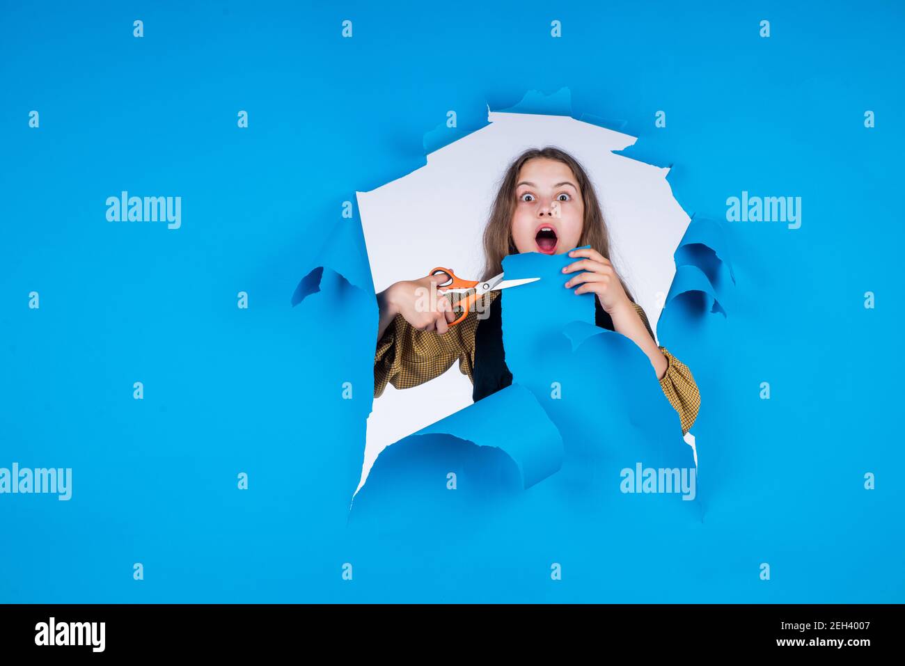happy teen girl cut paper with scissors, copy space, creativity Stock ...