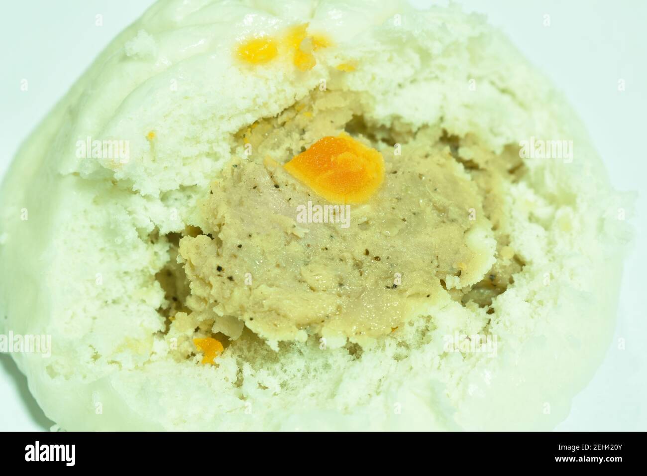 steamed bao Chinese bun stuffing mashed pork and salt egg on white ...