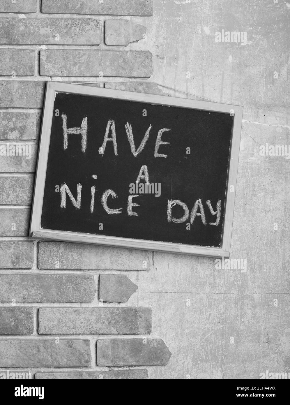 textured pastel and brick wall background and blackboard with positive ...