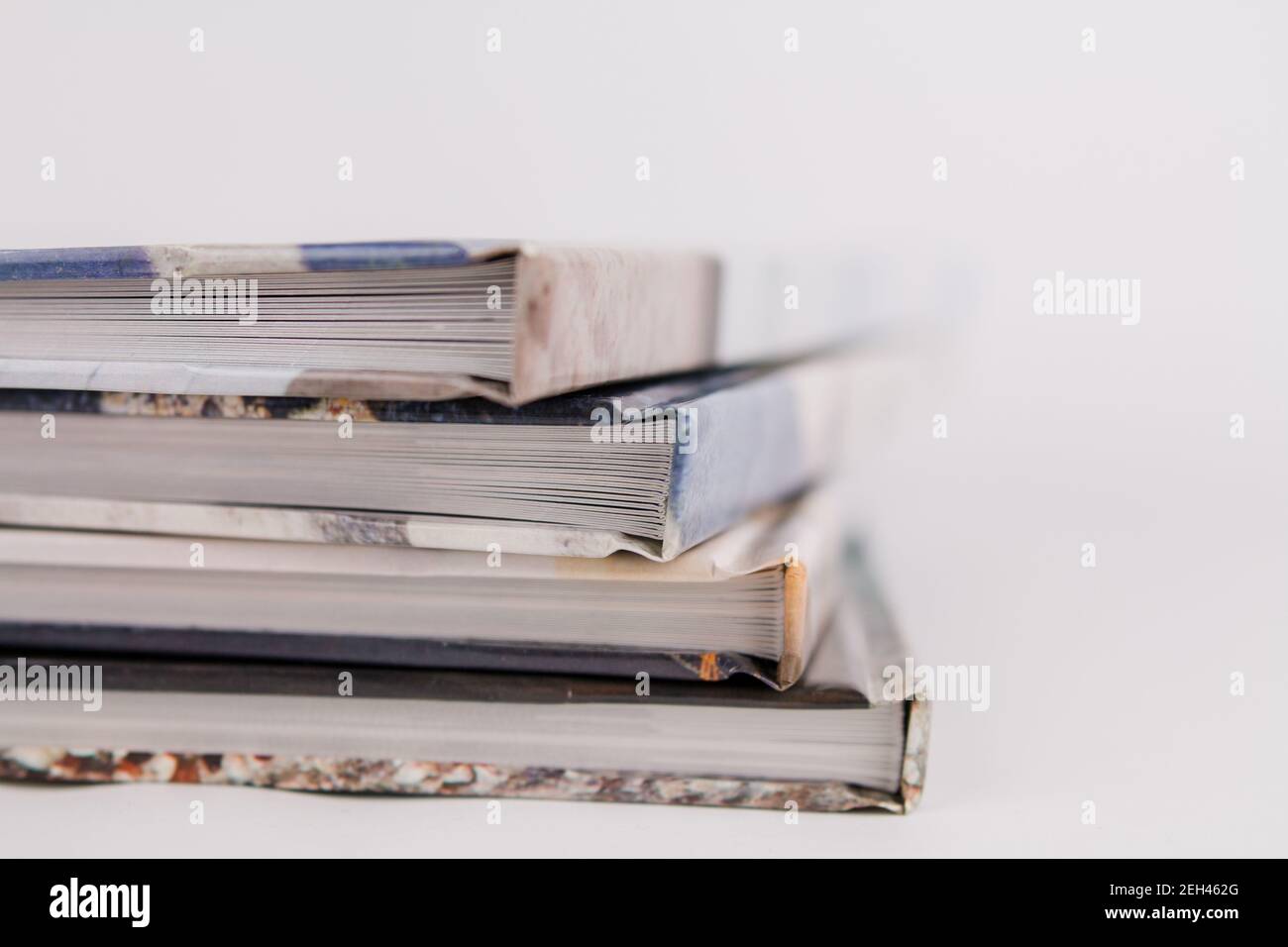 a books are in a pile on top of each other on a white background Stock ...