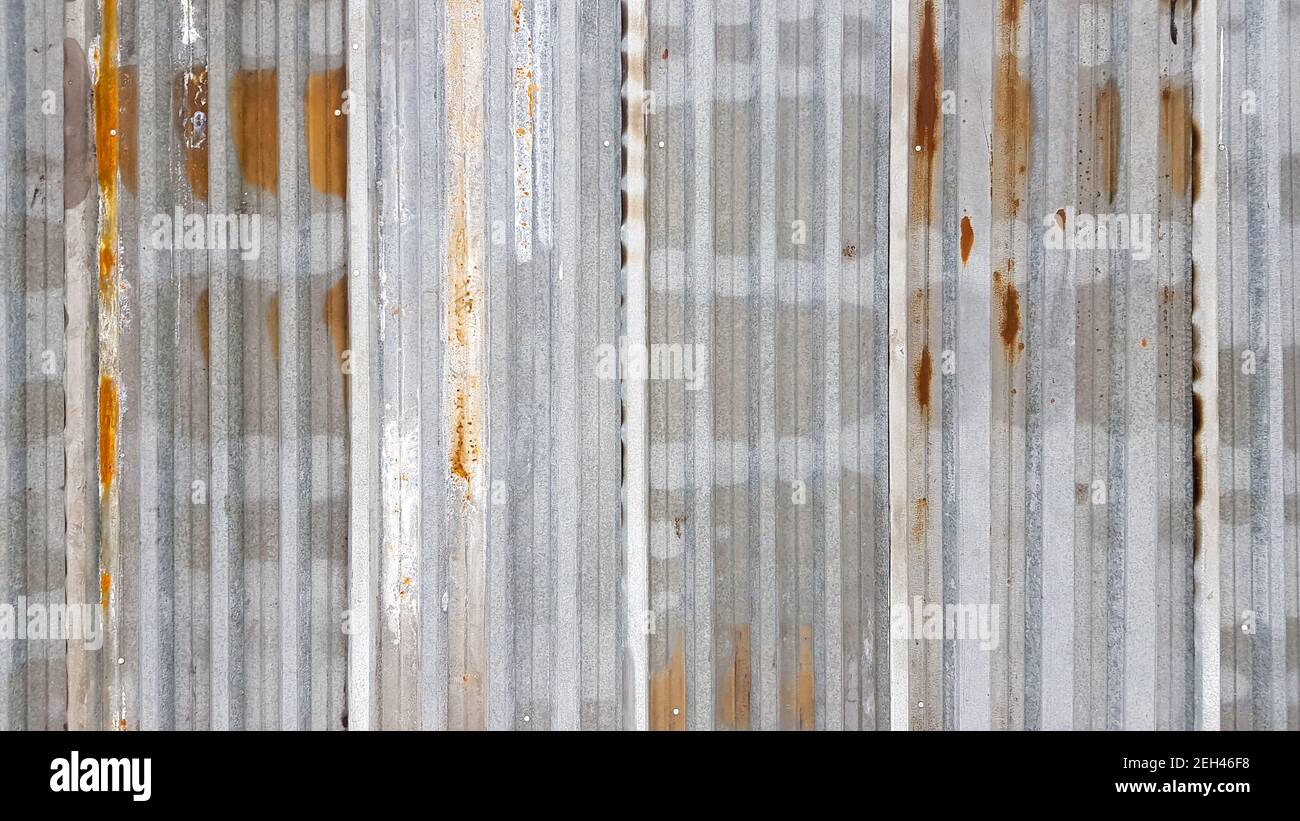 A rusty and weathered piece of corrugated metal. Corroded galvanized ...