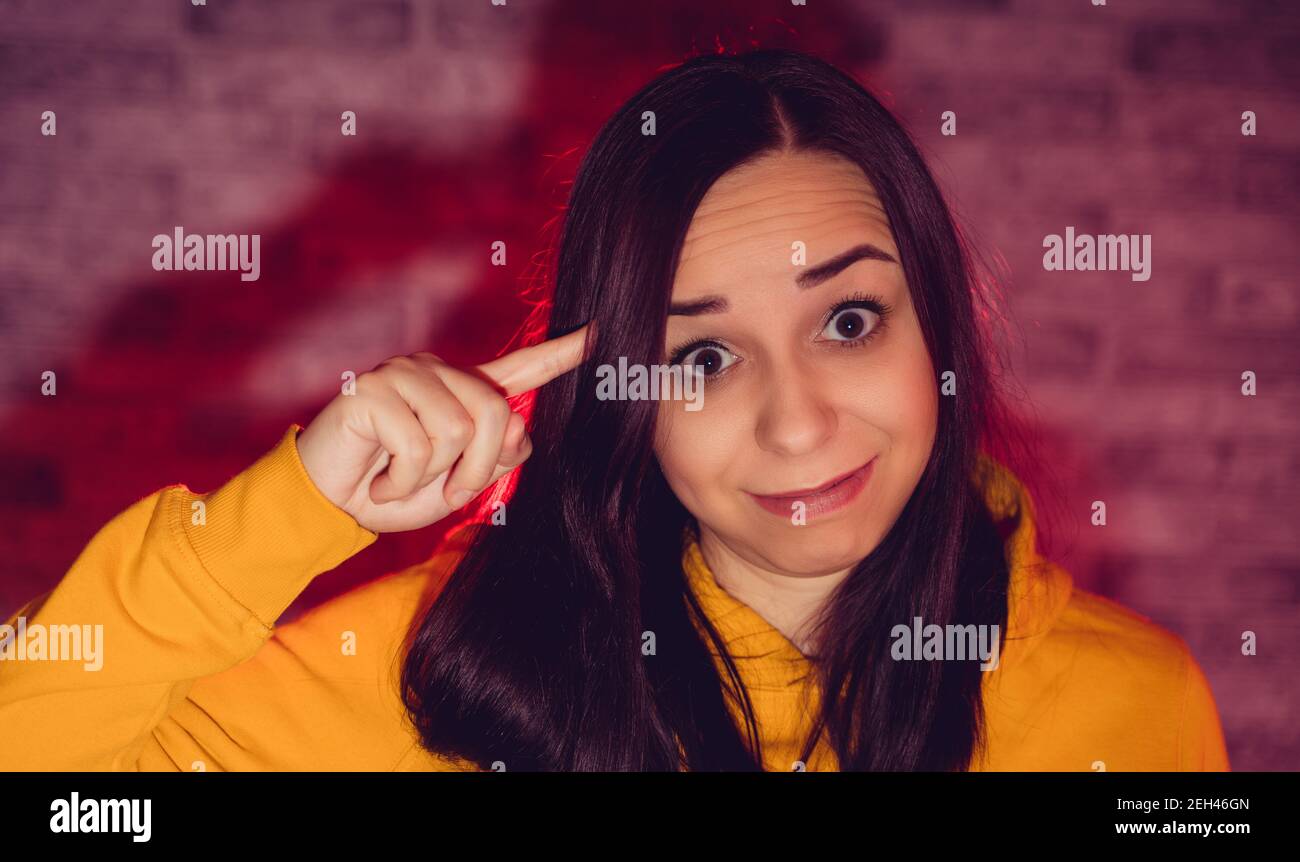 Finger at the temple hi-res stock photography and images - Alamy