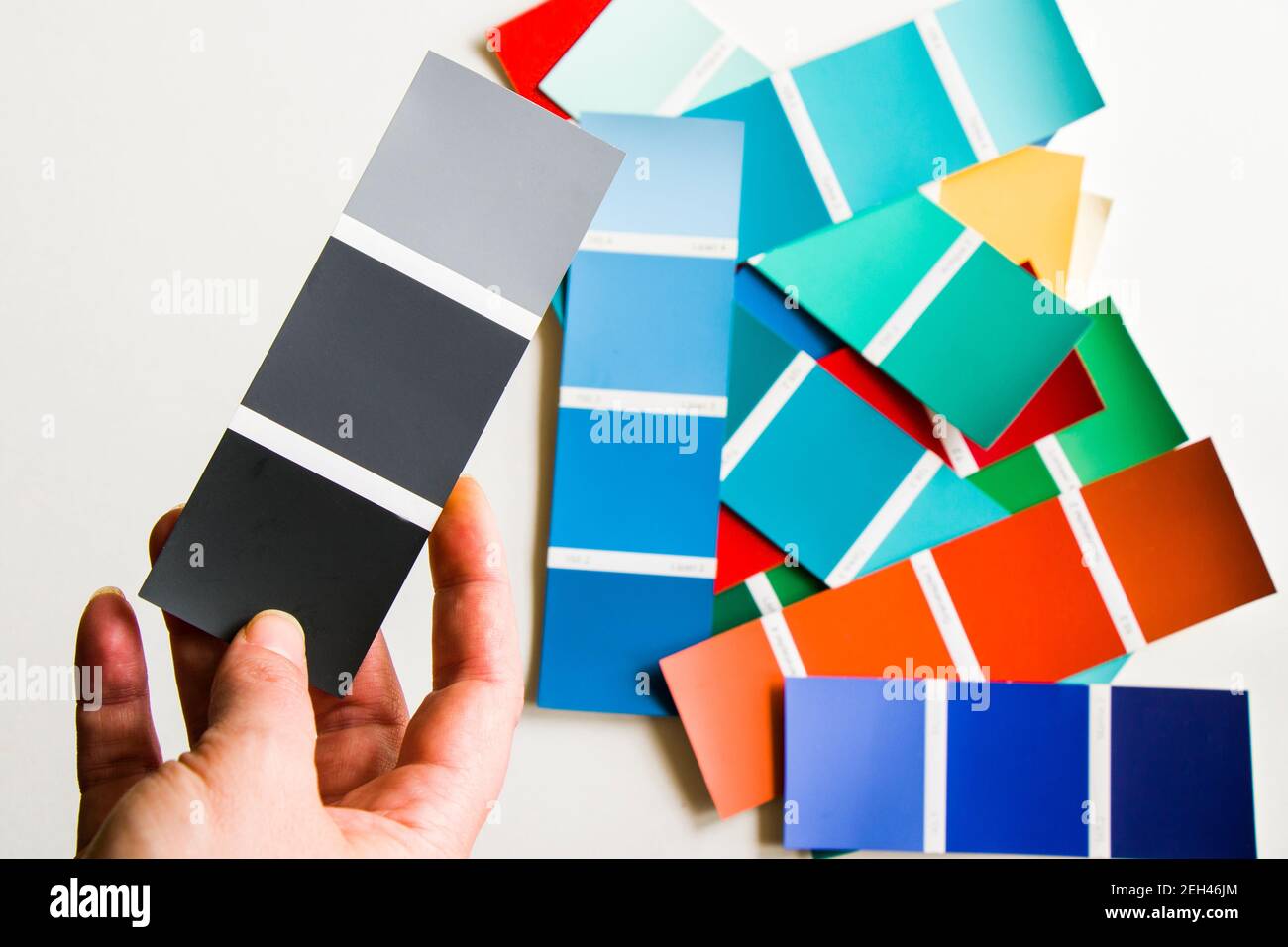 High angle view of color cards on the white background, colorful ...