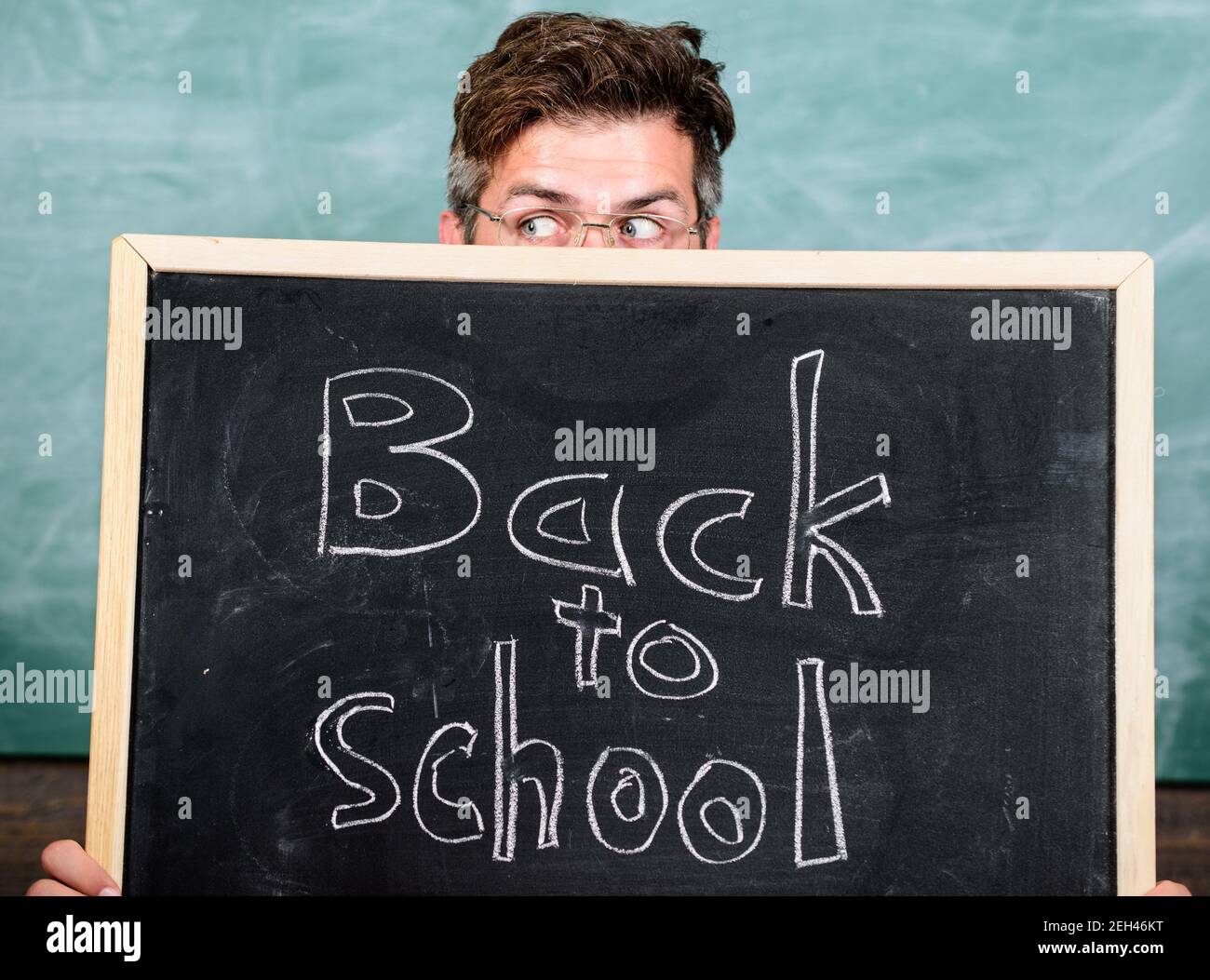 Teacher or school principal welcomes inscription back to school ...