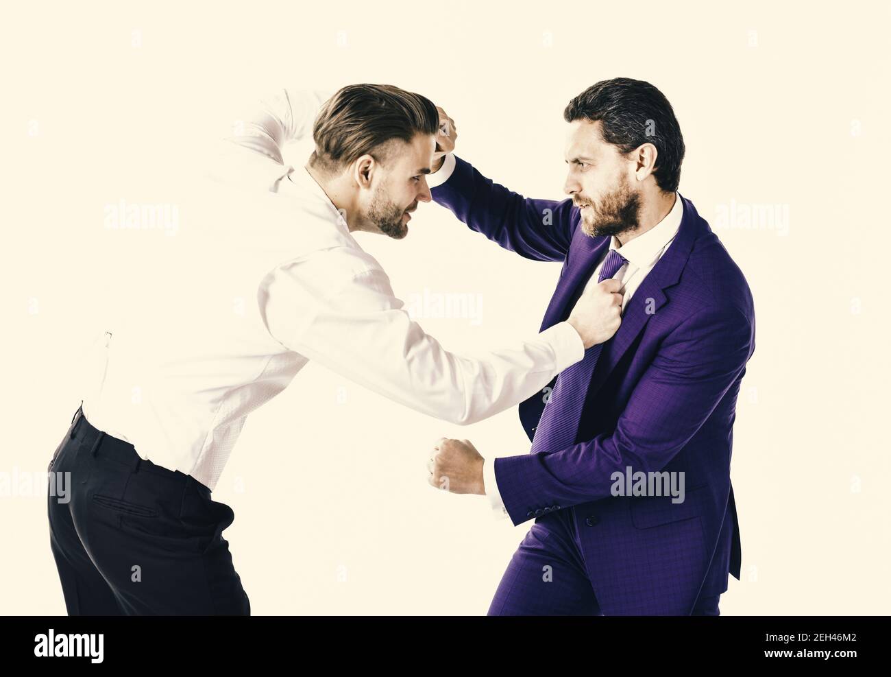 Businessmen fighting at workplace. Business conflict concept. Young men ...