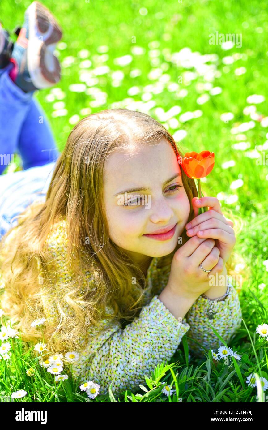 Spring break concept. Child enjoy spring sunny day while lying at ...