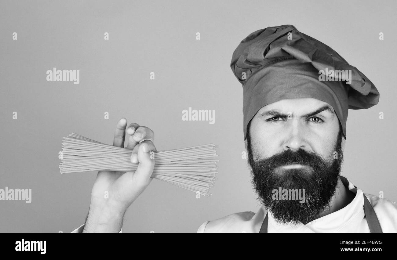 Man with beard isolated on red background. Italian cuisine and tasty ...