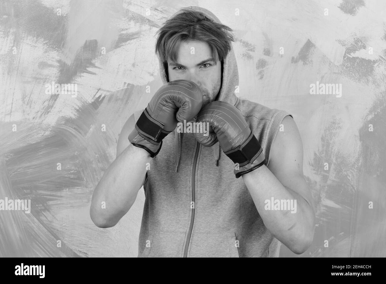 Sports, box and fight concept. Boxer with concentrated face trains to ...