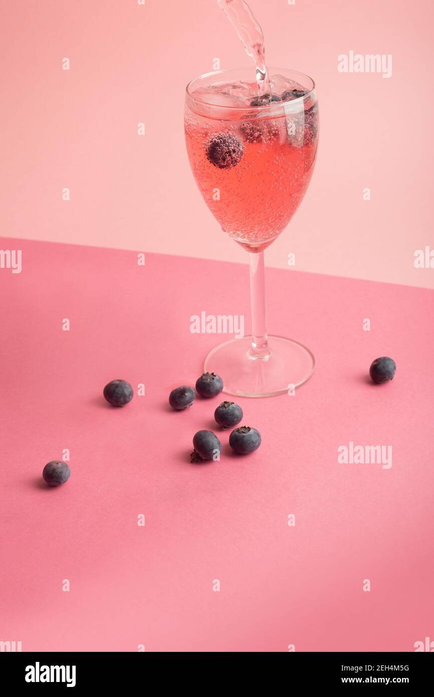 pink cocktail on pink background Stock Photo - Alamy