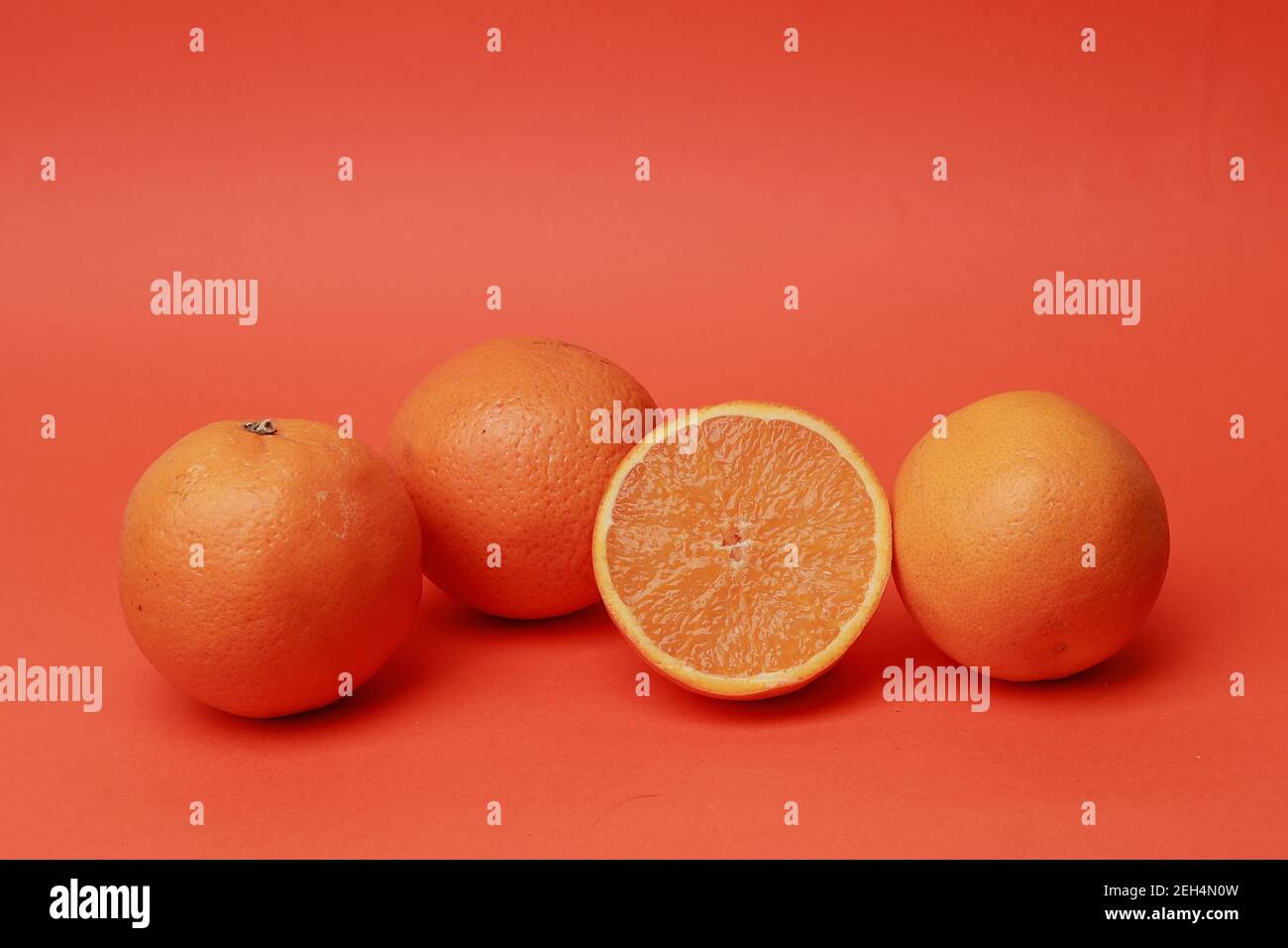 still life of oranges on an orange background Stock Photo - Alamy