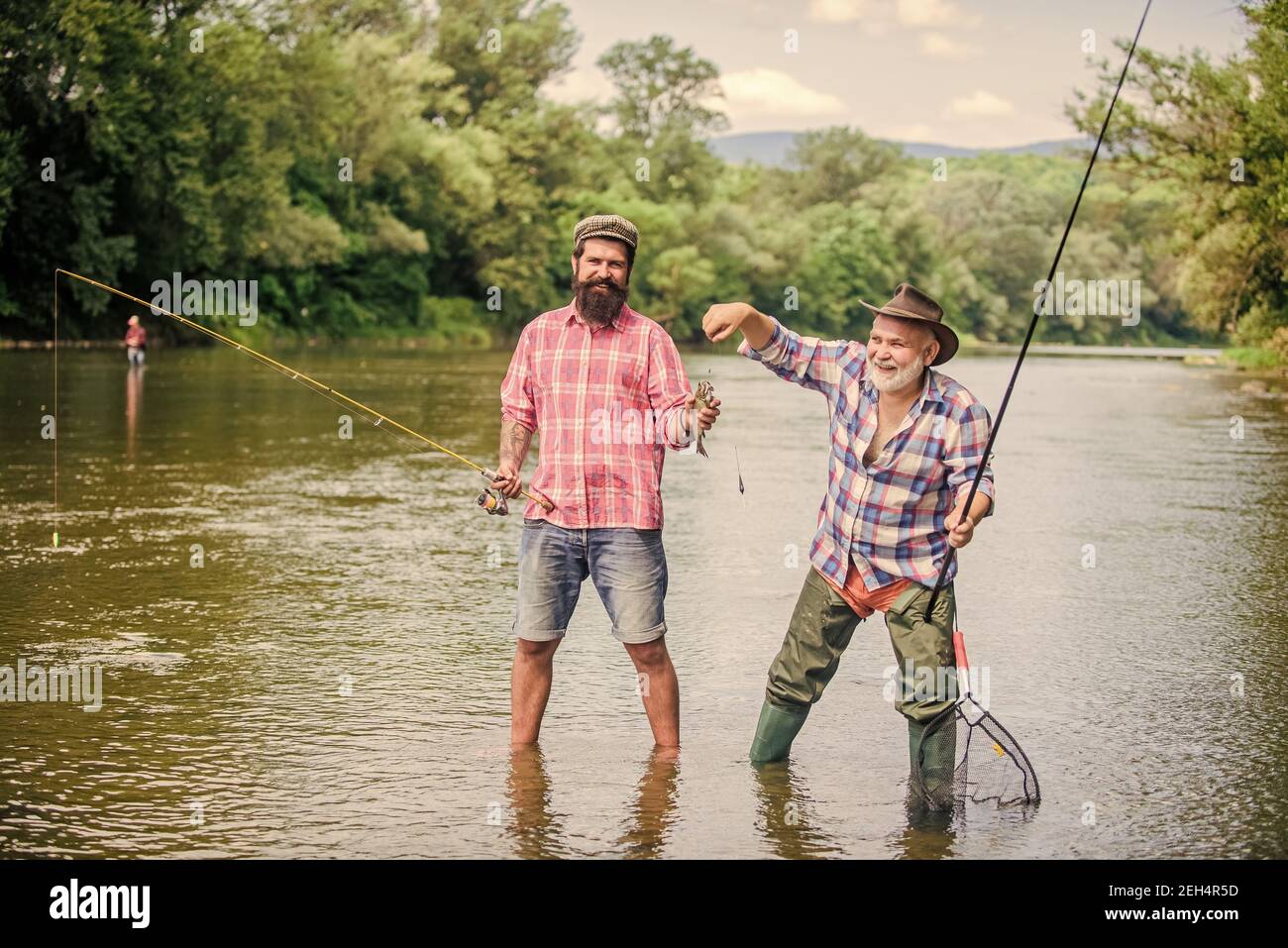 Dynamic Hobbies. two happy fisherman with fishing rod and net. Camping ...