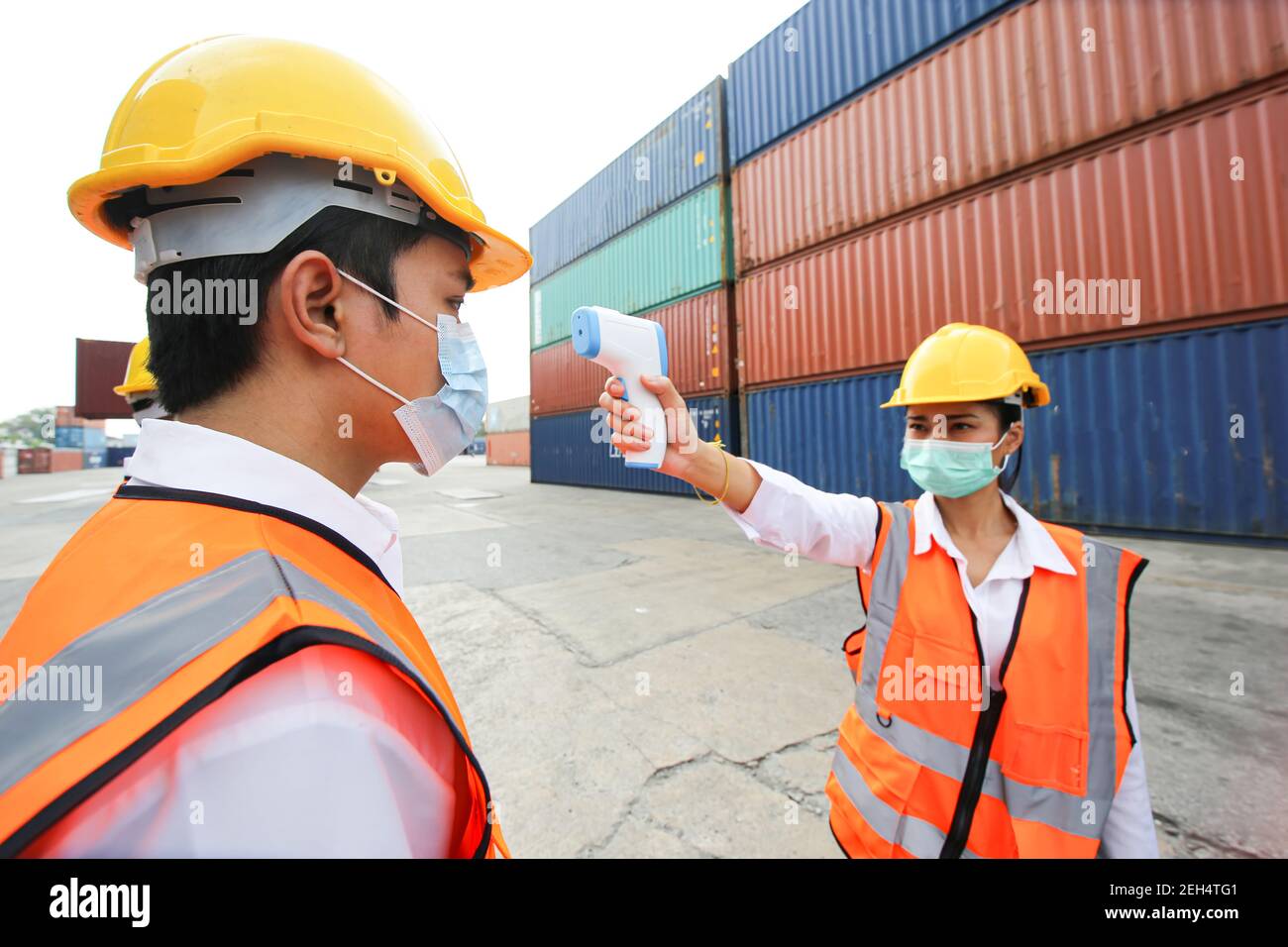 Foreman control loading Containers box from Cargo freight ship for ...