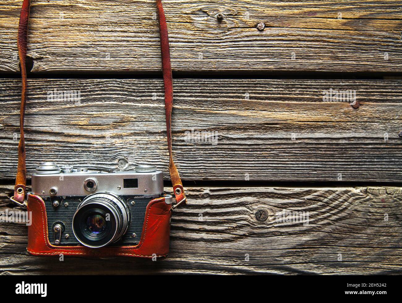 Retro camera on wood table background, vintage color tone Stock Photo ...