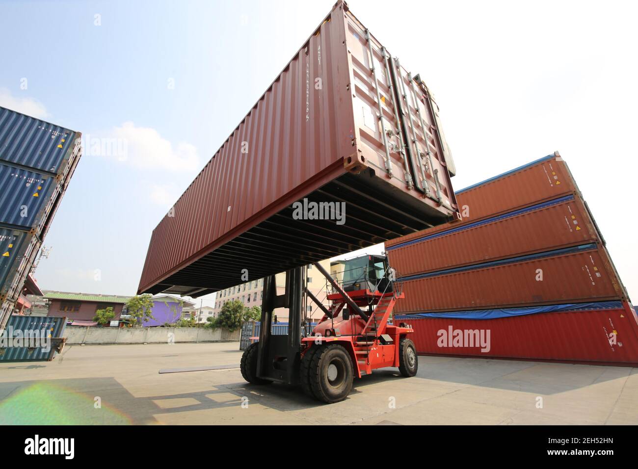 Foreman control loading Containers box from Cargo freight ship for ...