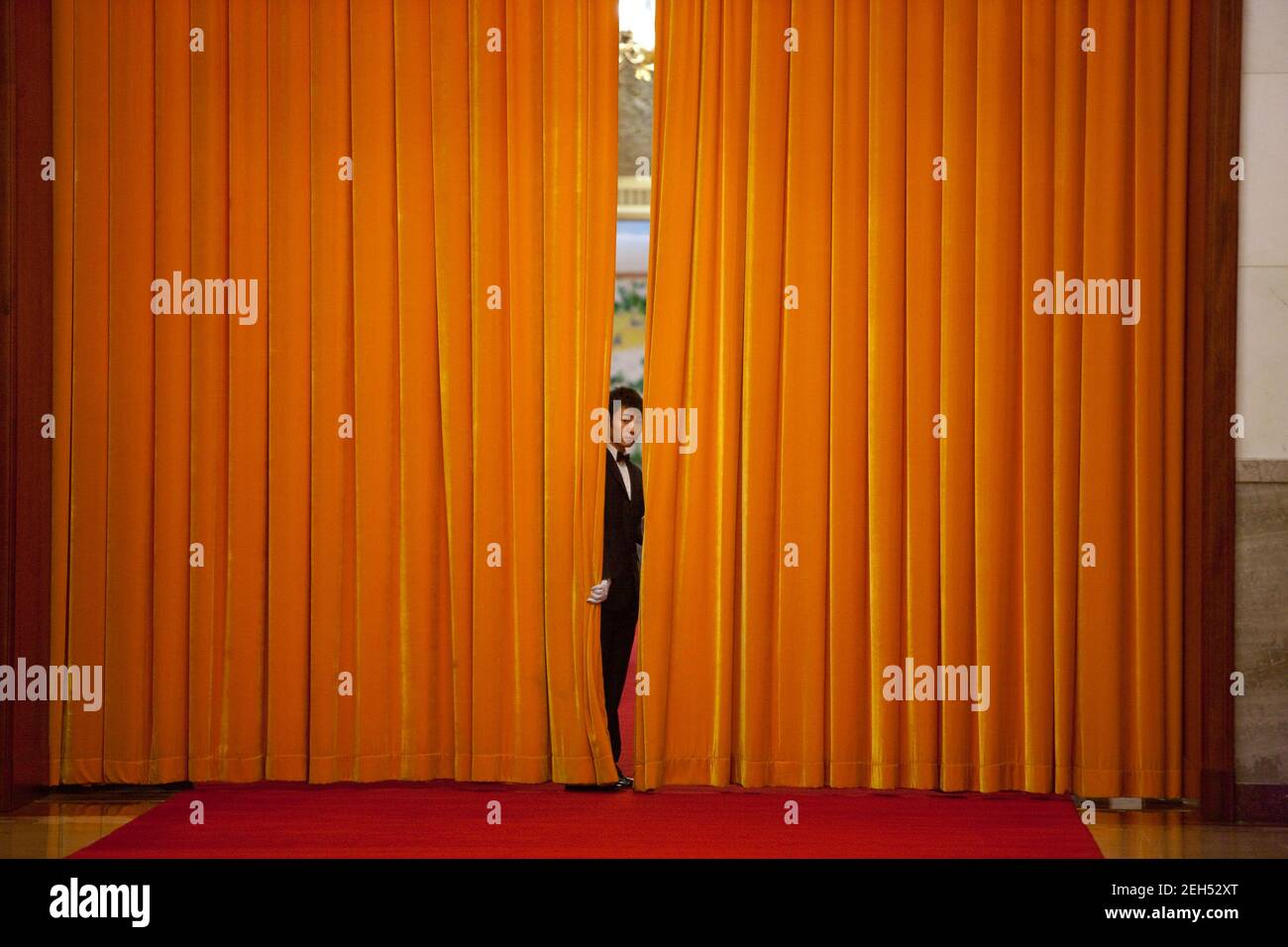 Chinese staff prepare for the arrival of President Barack Obama before ...