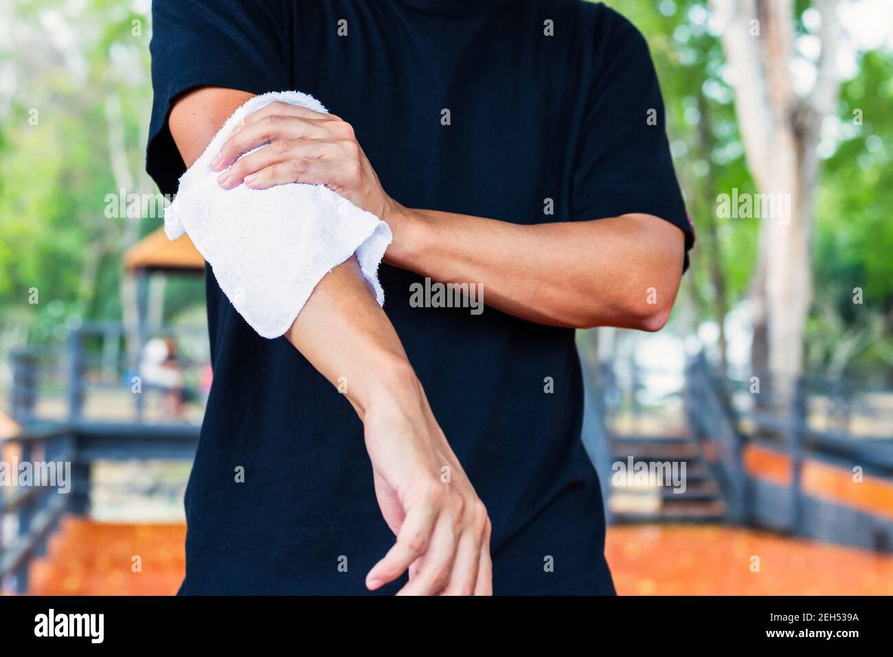 Man wiping off the sweat in the parks Stock Photo - Alamy
